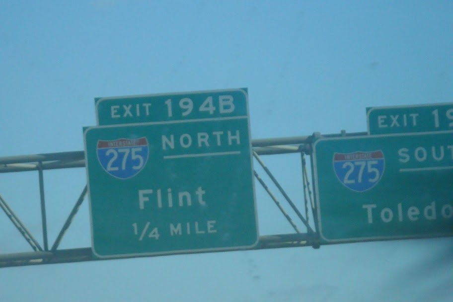Old freeway signs with underlined cardinal directions I saw