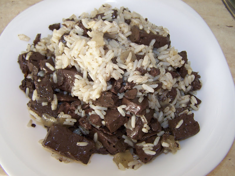Horno de Piedra: Sangre encebollada con arroz