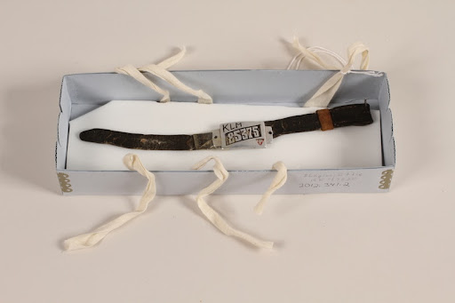 Prisoner identification tag stamped 85375 with leather band worn by a ...